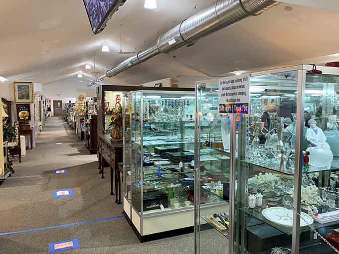 Step inside where glass cases gleam like Ali Baba's cave, packed with enough vintage sparkle to dazzle.