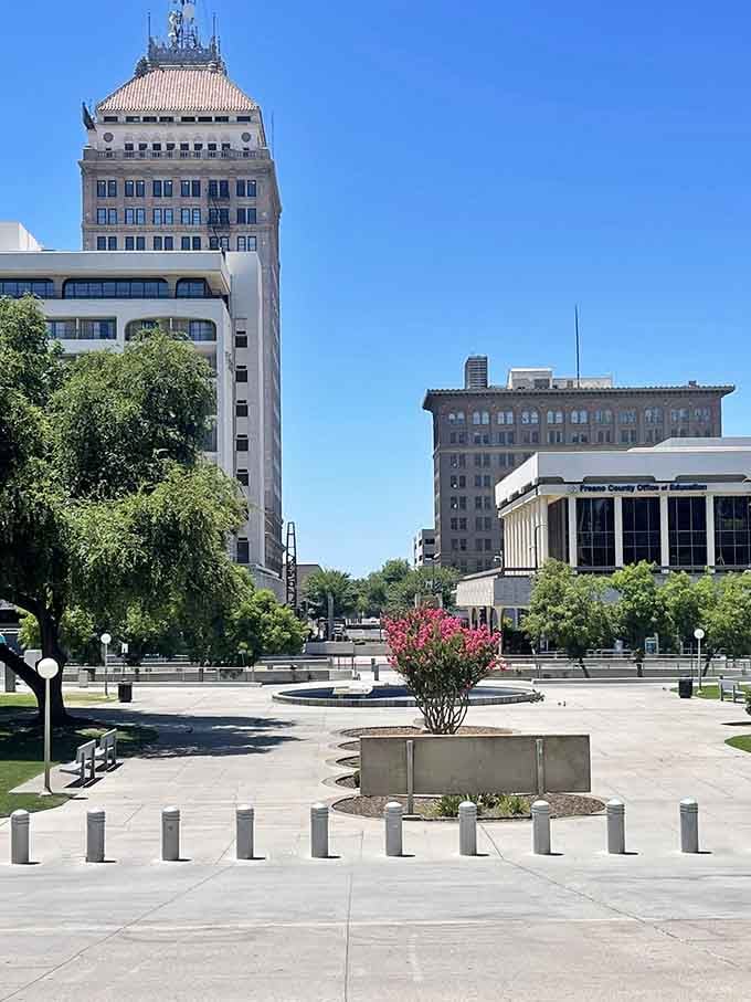 Downtown Fresno's skyline basks in California sunshine, where historic towers and modern buildings create an urban oasis surrounded by agricultural abundance.