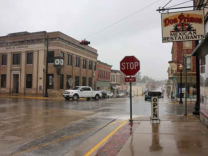 The Bank of Louisiana anchors the corner with dignified brick, while Dos Primos tempts passersby with authentic Mexican flavors.