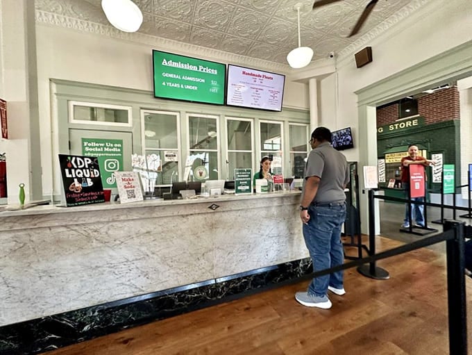 The admission counter welcomes you with vintage charm and the promise of fizzy adventures waiting just beyond those doors.