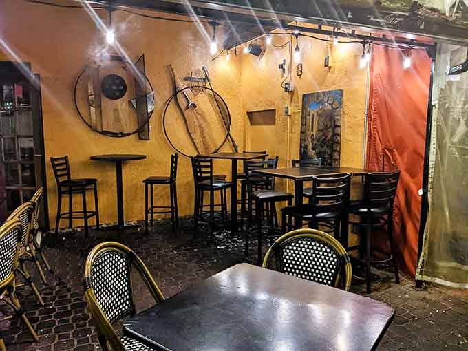 Cozy interior seating where intimate conversations happen over exceptional small plates and perfectly mixed drinks throughout the evening.