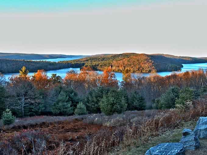 Fall foliage meets endless water in a scene that'll make you forget why you were rushing anywhere.