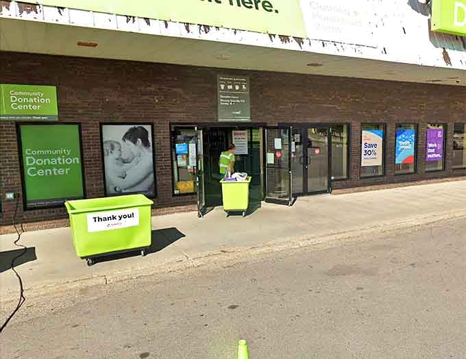 Green donation bins stand ready to transform yesterday's closet cleanouts into tomorrow's discoveries, the circle of thrift life in action.