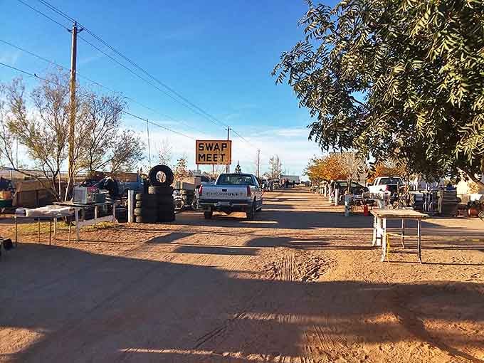 The entrance beckons with its no-frills charm. That hand-painted "SWAP MEET" sign might as well read "Adventure Starts Here."