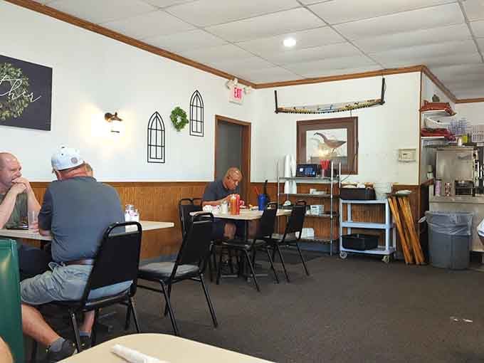 Simple booths, honest tables, and the kind of no-nonsense atmosphere where the food does all the talking.