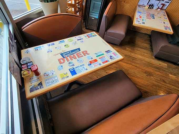 Classic diner booths with retro tabletops create the perfect setting for your morning feast.