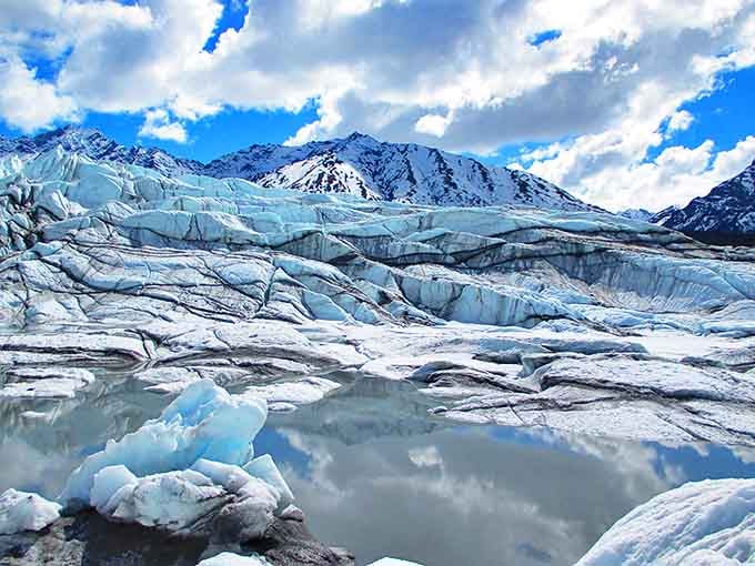 Ancient ice sculpted into a frozen wave caught mid-crash. Mother Nature's been working on this masterpiece for thousands of years&mdash;talk about patience!