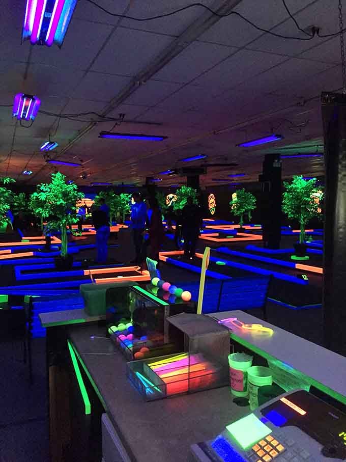 The sprawling courses stretch out like a neon dreamscape, where every surface glows with otherworldly intensity and possibility.