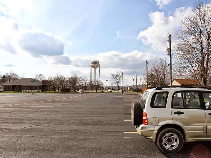 That water tower stands watch over town like a patient guardian, visible from every corner of this charming community.