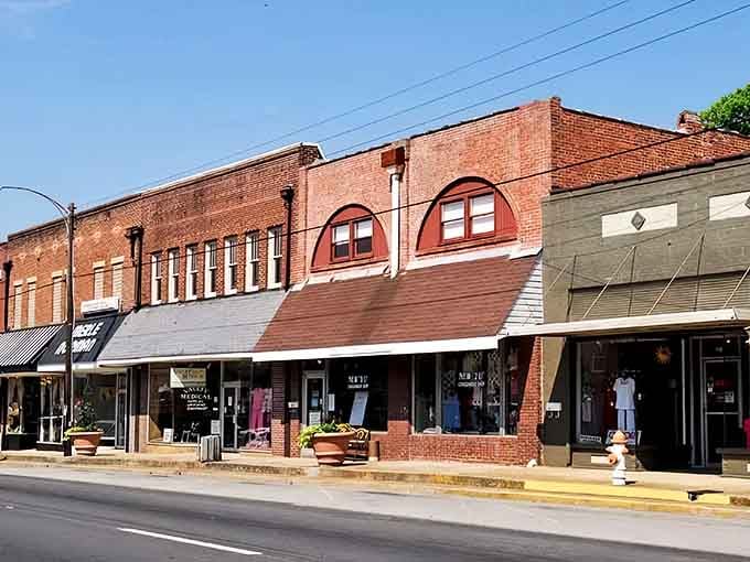 Classic brick storefronts line downtown streets where Southern charm meets small-town shopping and genuine hospitality.