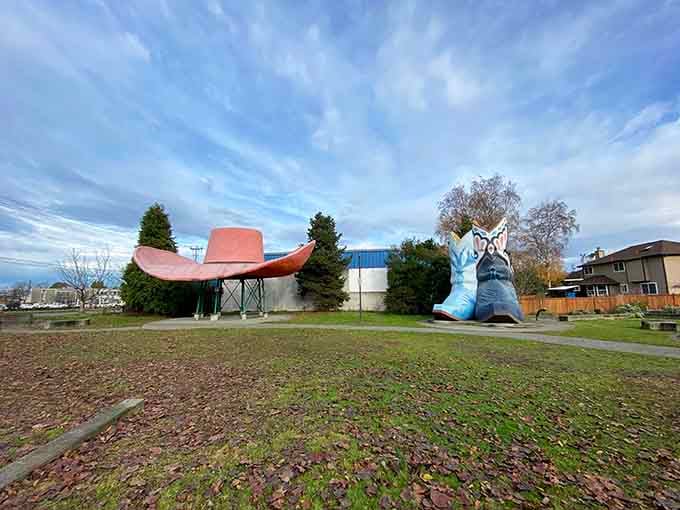 A peaceful park view where giant cowboy accessories somehow feel perfectly at home in urban Seattle.