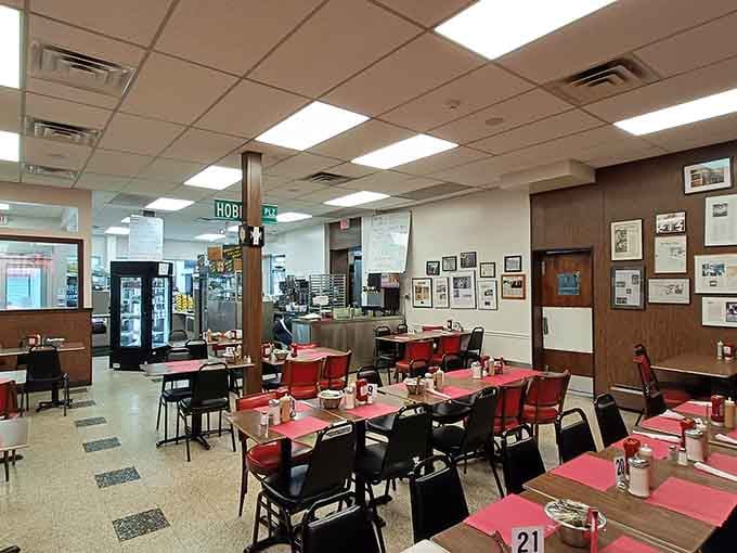 Red-topped tables and vintage tile floors create the kind of atmosphere that makes every meal feel like coming home.