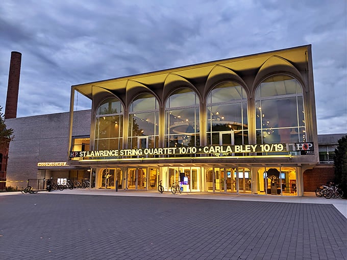 The Hopkins Center glows like a cultural lighthouse at dusk, beckoning with promises of string quartets and world-class performances.