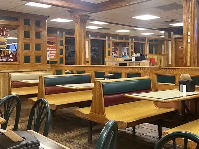 Classic booth seating where three generations have solved life's problems, one Texas wiener at a time.