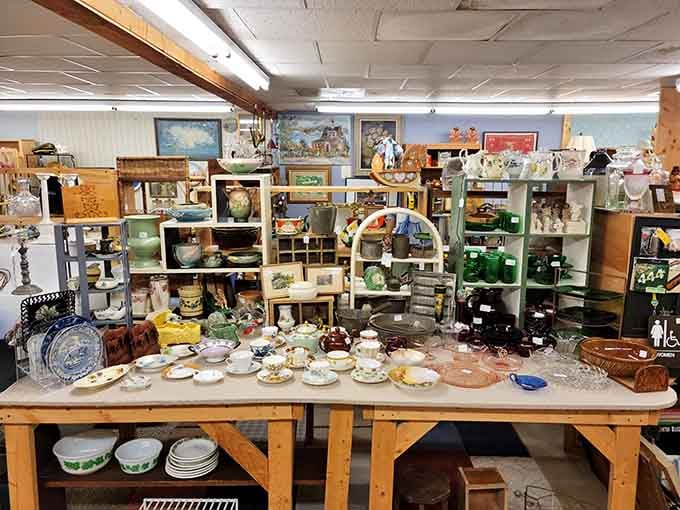 China teacups and porcelain figurines stand at attention like an elegant army of the past, each piece whispering tales of bygone dinner parties.