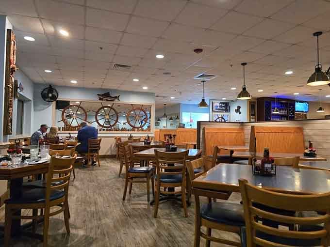 Ship wheels and wooden accents create that perfect "coastal casual" vibe where flip-flops are welcome and seafood stories flow as freely as the conversation.
