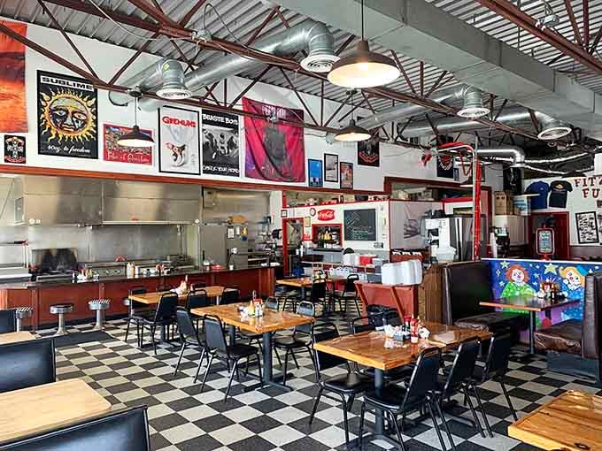 Step inside and time-travel to simpler days. The checkered floor, vintage posters, and open kitchen create the diner trifecta of nostalgic perfection.