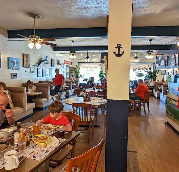 Nautical touches and cozy booths create that perfect small-town diner atmosphere where conversations flow as freely as the coffee refills.
