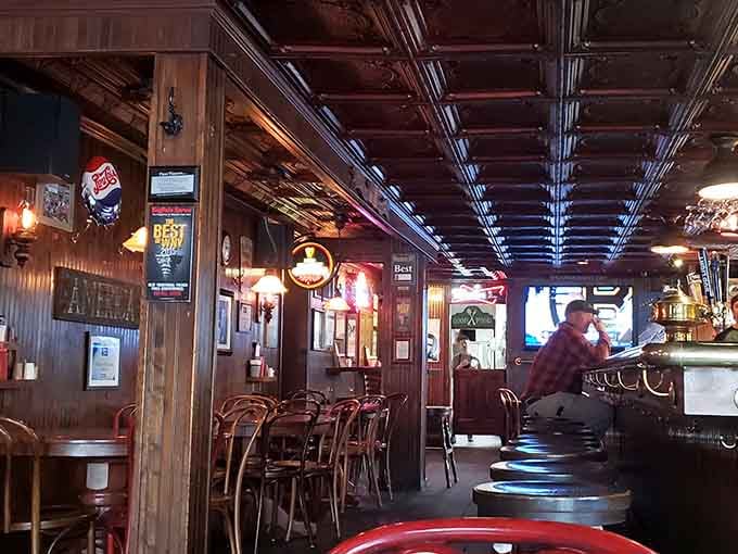 Wood paneling and tin ceilings create that timeless tavern atmosphere where great meals and better memories happen naturally.