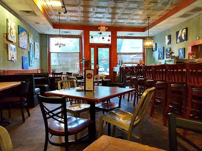 Step inside and discover a space where mismatched chairs and eclectic art create the perfect breakfast atmosphere.