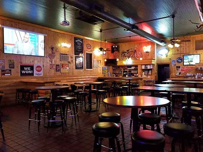 Wood-paneled walls and communal tables create that perfect neighborhood vibe where strangers become friends over exceptional fried fish.