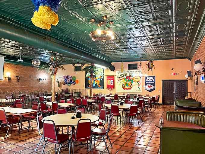 Step inside to discover a dining room where the ornate tin ceiling watches over decades of happy meals and even happier conversations.
