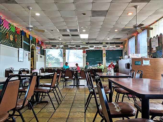 Inside, colorful papel picado banners and no-nonsense tables create that rare atmosphere where both abuelitas and hipsters nod in approval.