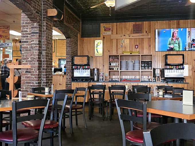 Exposed brick meets wooden paneling in this cozy interior where countless pizza dreams have come true for generations of hungry Missourians.