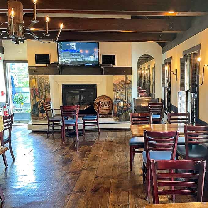 Exposed beams, wide-plank floors, and colonial-inspired lighting create an atmosphere where you can practically hear the echoes of revolutionary conversations past.