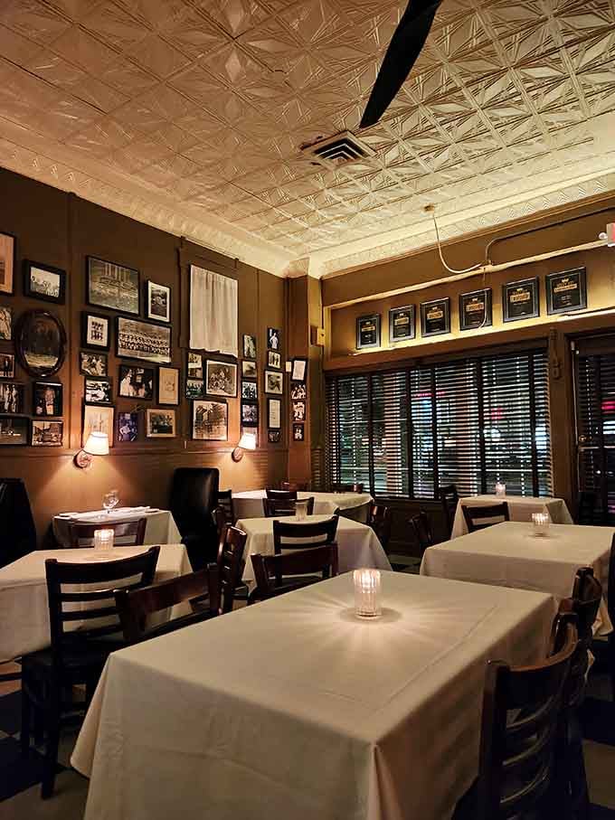 Pressed tin ceilings and vintage photographs create an atmosphere where history isn't just remembered, it's actively dining alongside you.