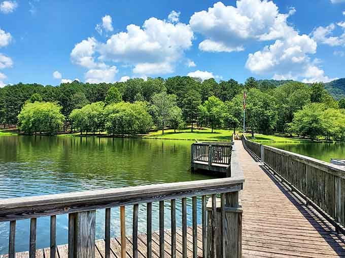 This fishing pier stretches toward mountain views that make you forget your phone exists back in the car.
