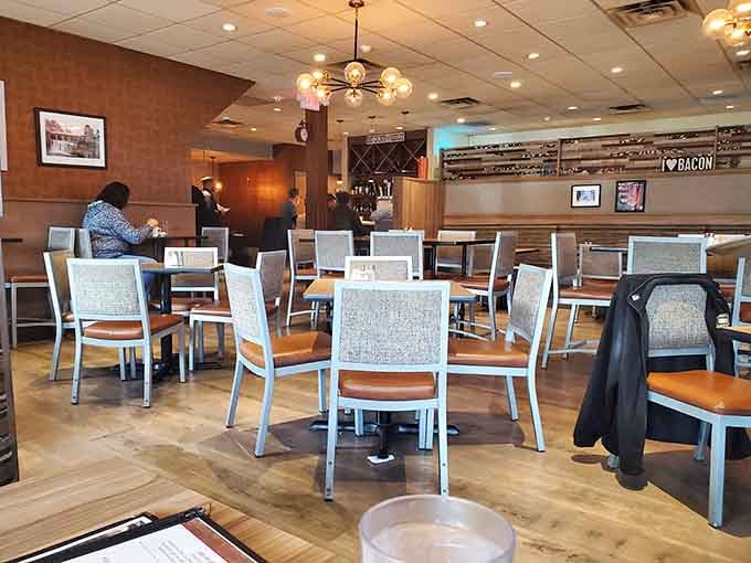 Clean lines, warm wood tones, and enough space between tables to actually enjoy your conversation&mdash;breakfast civilization at its finest.