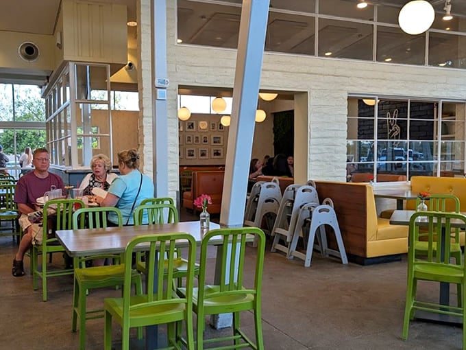 Clean lines, bright chairs, and natural light create the kind of space where good conversations happen naturally.