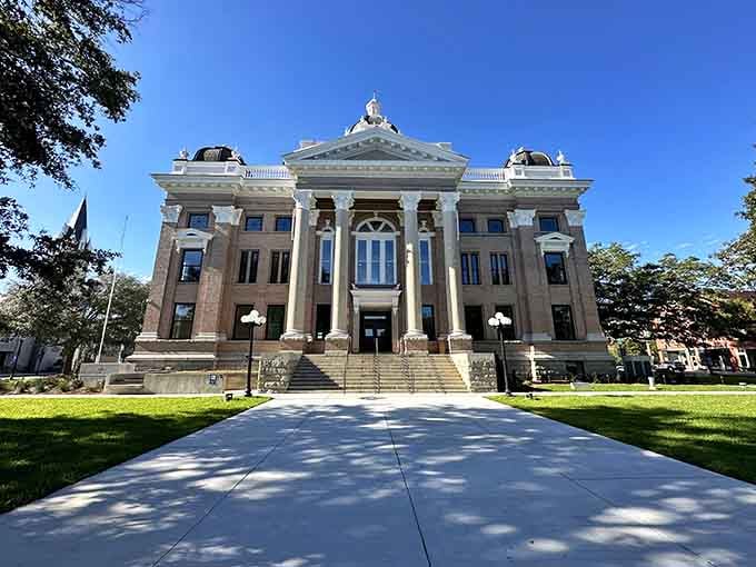 The Lowndes County Courthouse stands as a neoclassical masterpiece in downtown Valdosta, its grand columns and symmetrical design exuding Southern dignity and historical significance.