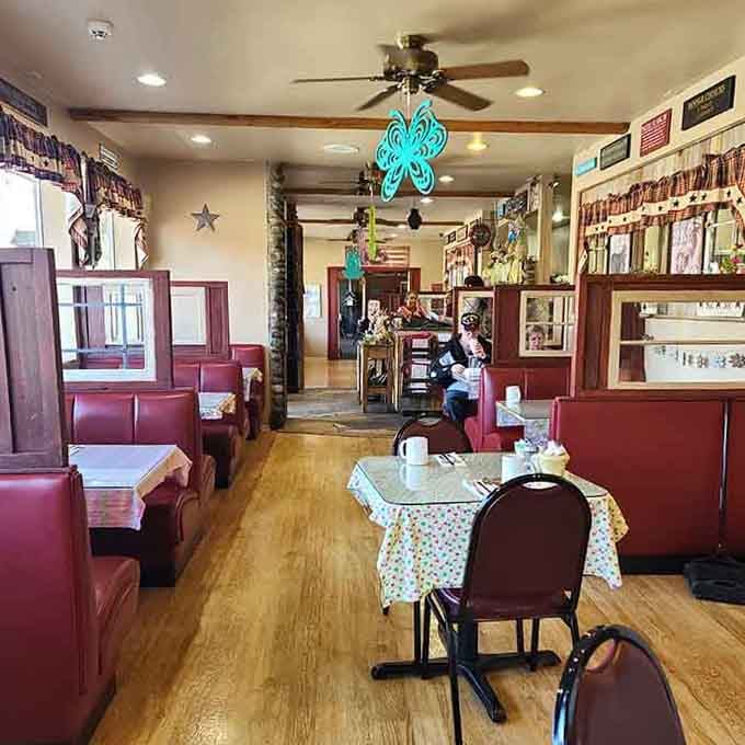 Step into a dining room where ceiling fans spin and booths actually fit real people, not fashion models on diets.