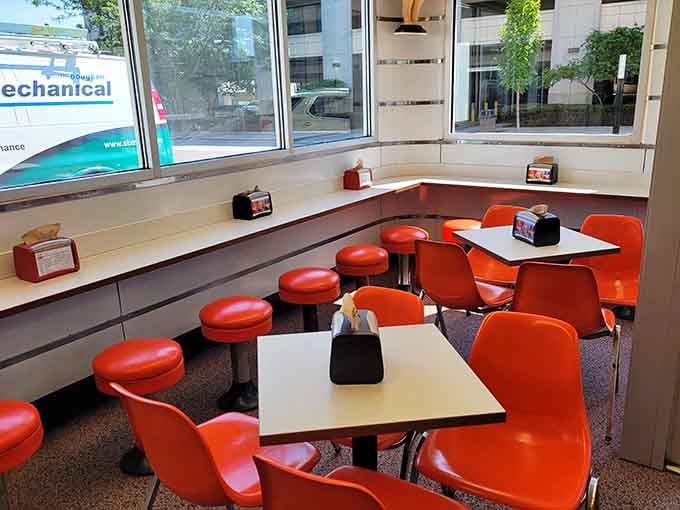 Orange chairs and counter stools create a retro vibe that makes you want to order a malt immediately.