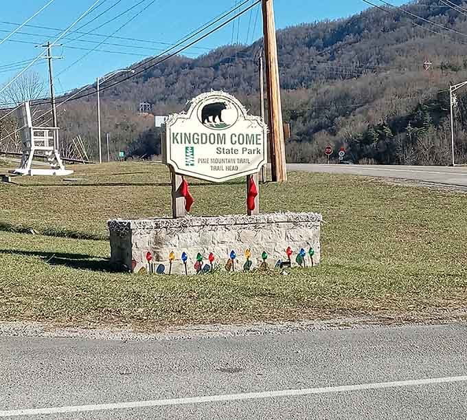 Welcome to Kingdom Come, where even the entrance sign promises adventure and those colorful hikers know what's waiting up ahead.