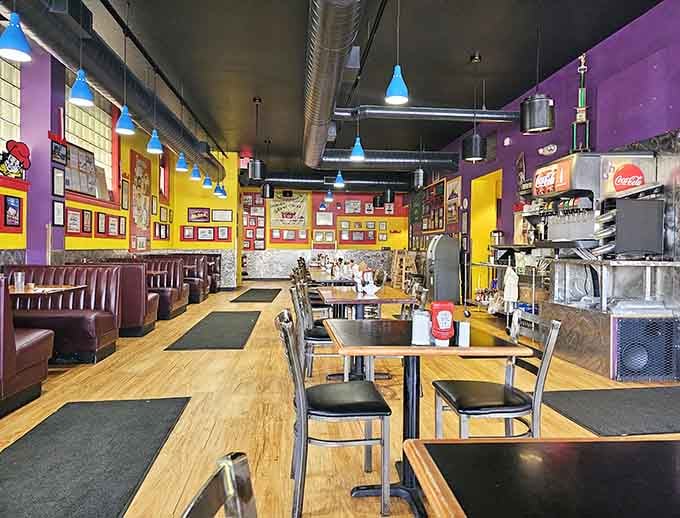Classic diner seating meets vibrant walls in a space that celebrates color like Willy Wonka celebrated candy.