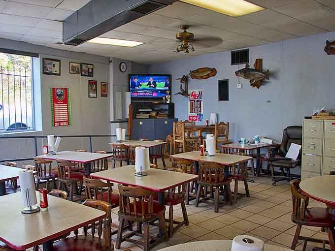 Simple tables, honest chairs, and walls that have absorbed decades of satisfied sighs and barbecue dreams.