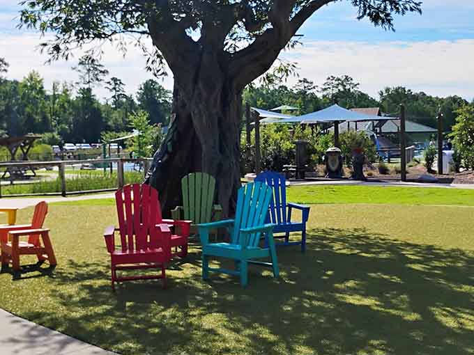 That artificial tree provides shade while those rainbow Adirondack chairs offer front-row seats to the greatest show: happy, playing children.