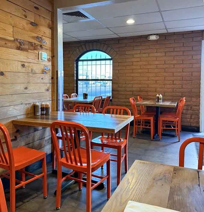 Simple orange chairs and exposed brick create the perfect no-frills setting for serious barbecue appreciation.