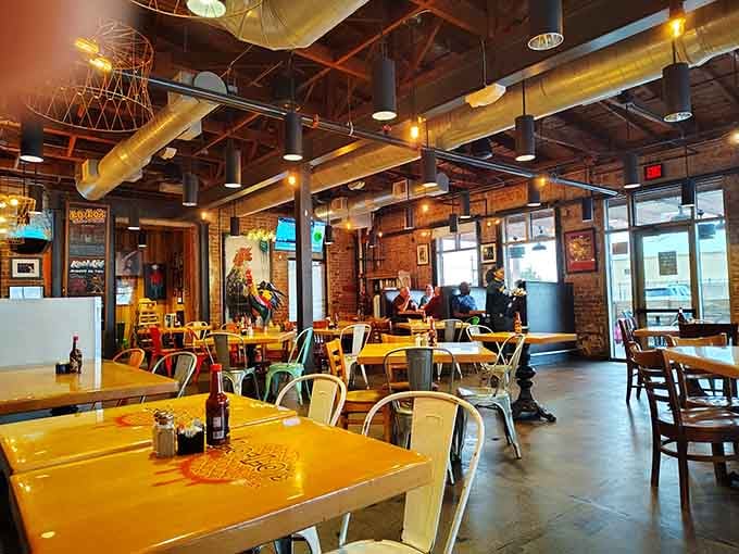 Exposed brick, warm lighting, and yellow tables create the perfect backdrop for your fried chicken dreams.
