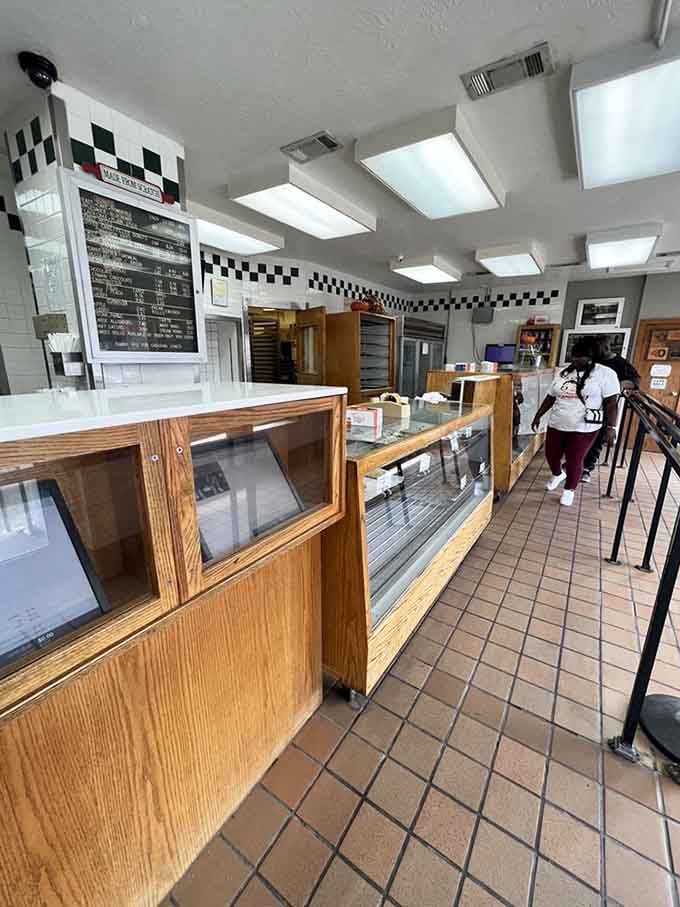 Step inside where checkered trim meets no-nonsense service, and the only thing fancier than the decor is the donuts.