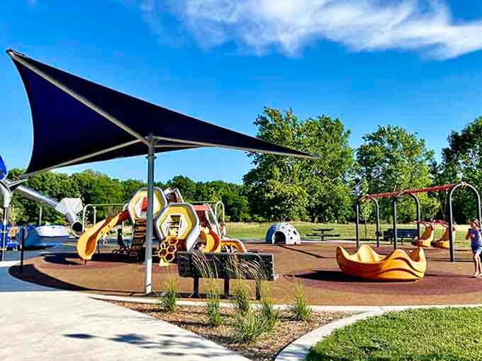 Shade sails keep everyone cool while the fun stays hot at this thoughtfully designed play paradise in Van Buren Township.