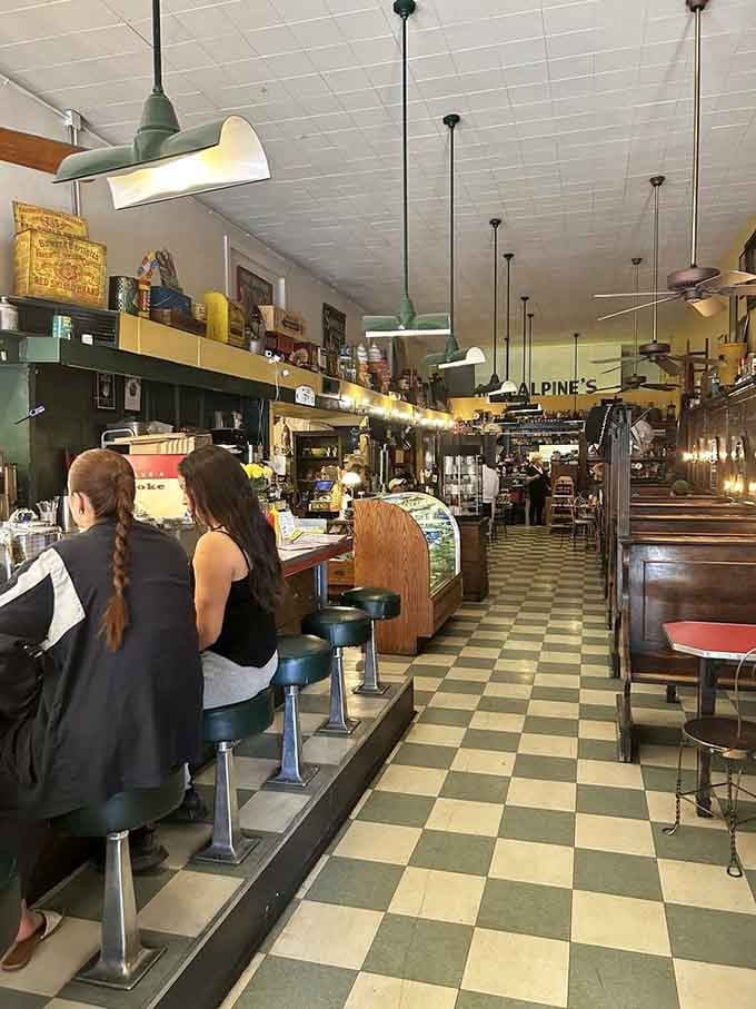 The checkered floor and counter stools create a scene straight from your favorite childhood memory, real or imagined.