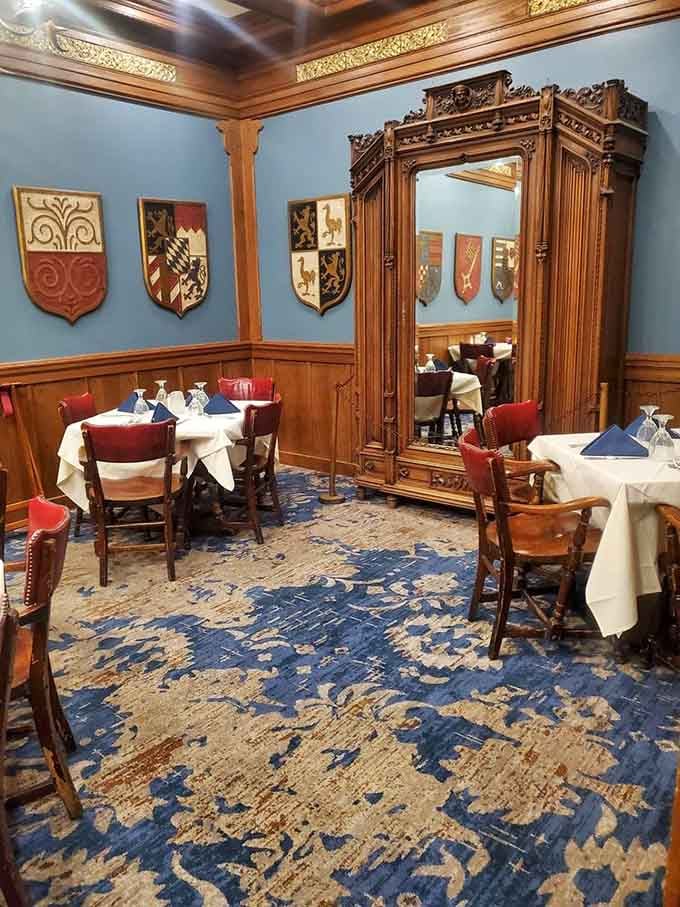 Step into a dining room where heraldic shields and ornate mirrors transport you straight to a Bavarian castle.