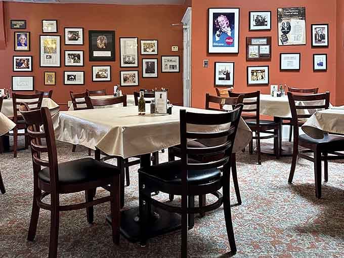 White tablecloths and walls full of memories create a dining room that feels like Southern history come alive.