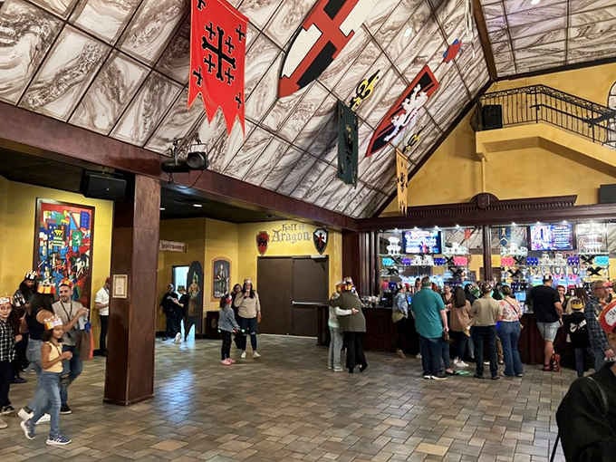 Inside, banners hang like laundry day at Camelot while crowds gather for the spectacle ahead.