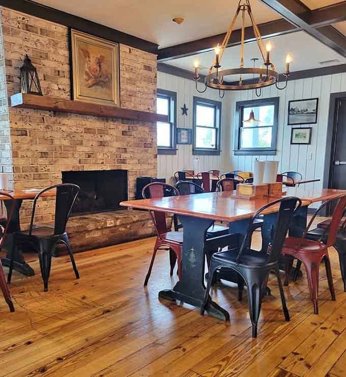 Exposed brick, wooden beams, and metal chairs create that perfect rustic-meets-modern vibe where comfort food feels right at home.