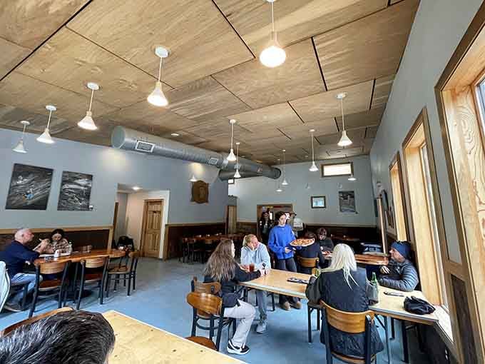 Inside, wooden tables and climbing photos create the perfect basecamp atmosphere for hungry adventurers.